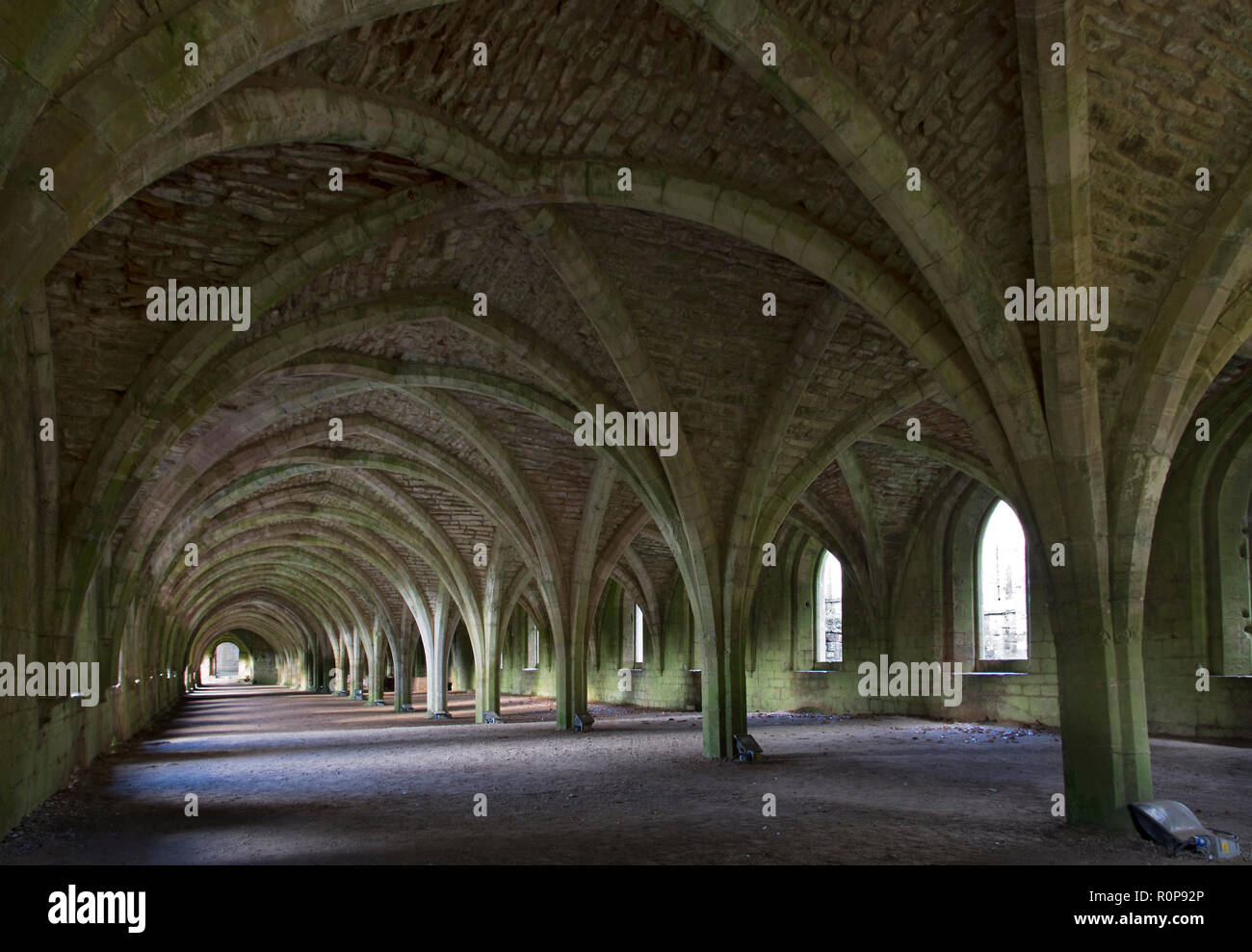 Gothic arches in the interior of the monastery ruins in Fountains Abbey ...