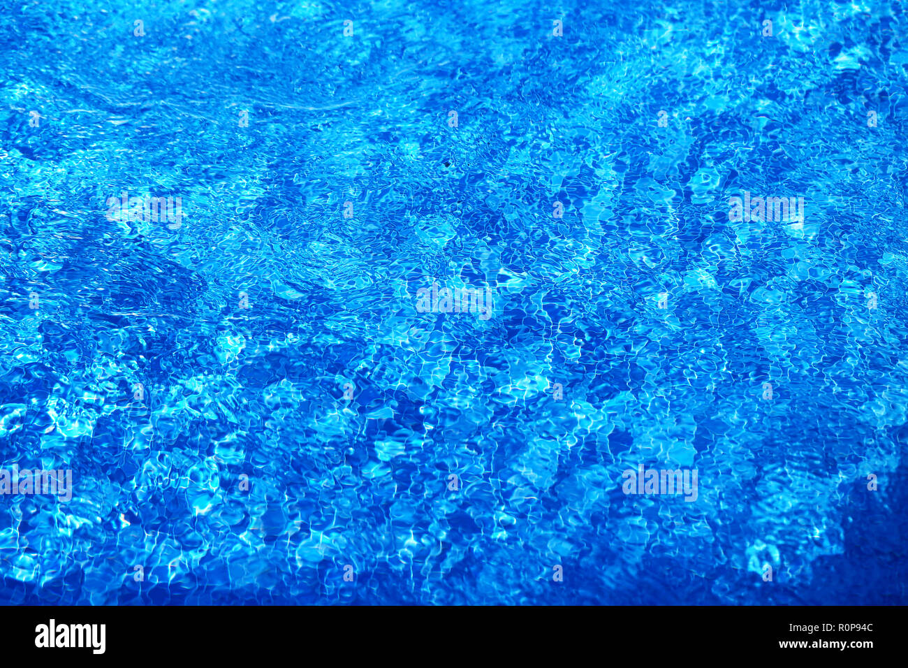 Photo super macro blue transparent sea water lit by the sun Stock Photo ...