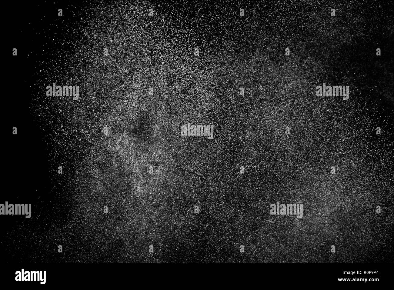 Abstract splashes of water on black background. Freeze motion of white ...