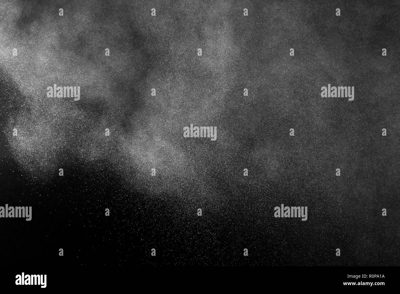 White powder explosion on black background. Abstract white dust texture ...