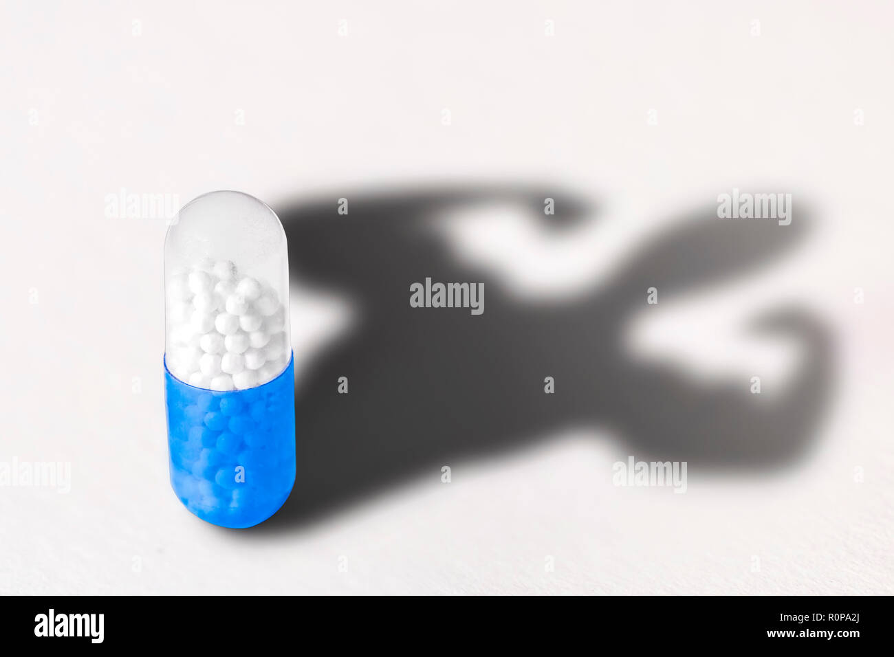 Pill shape - male muscular upper body Stock Photo - Alamy