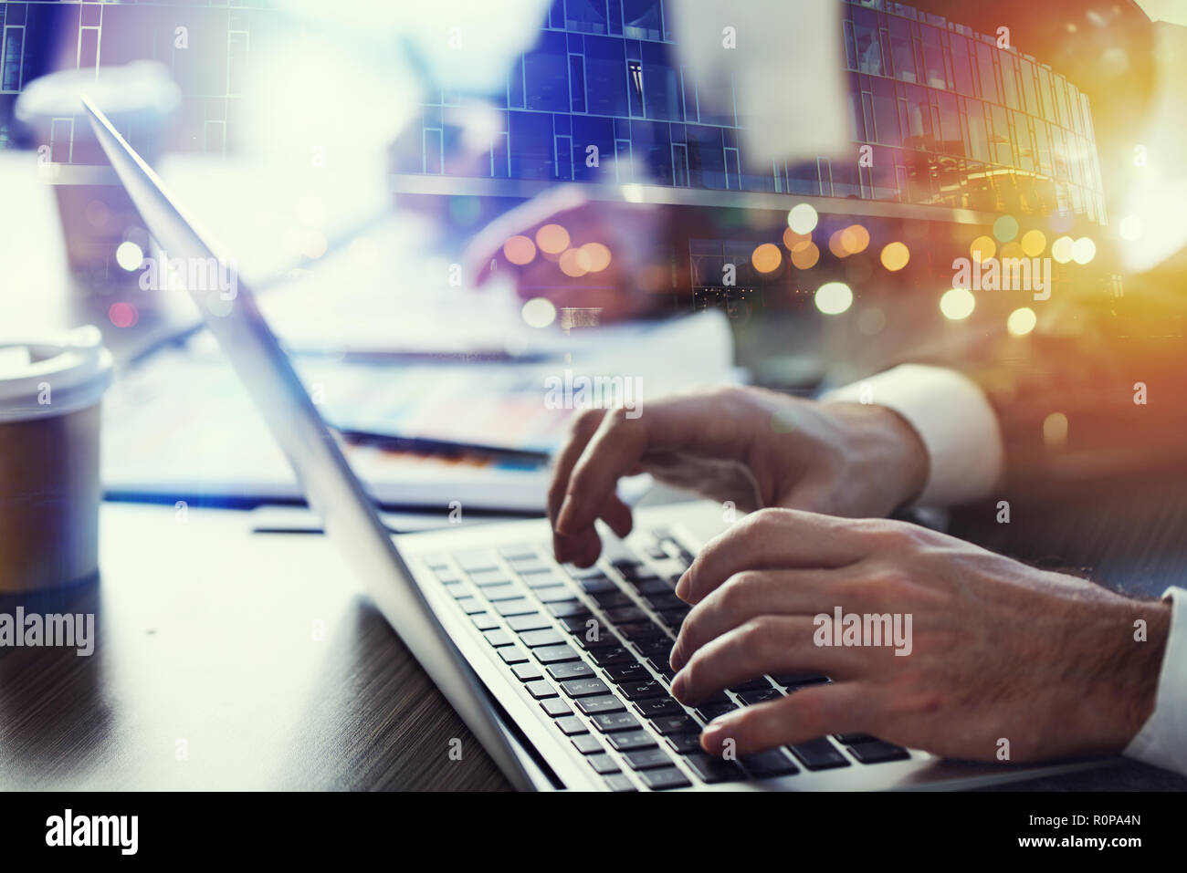 Business man works in office with laptop in the foreground. Concept of ...