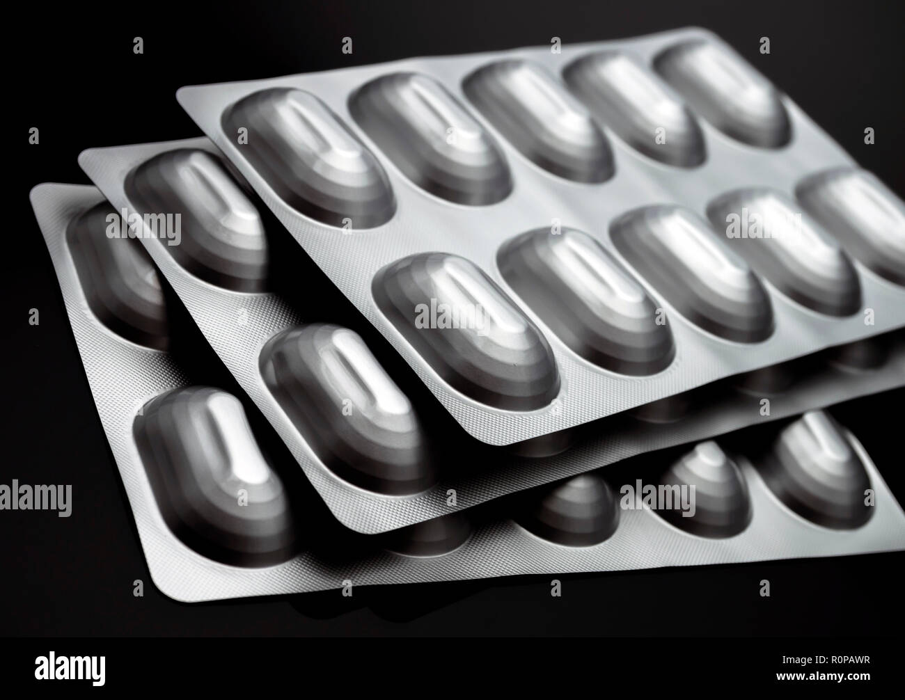 Many Medicines Pills Capsules Of Diferent Size Stock Photo - Alamy