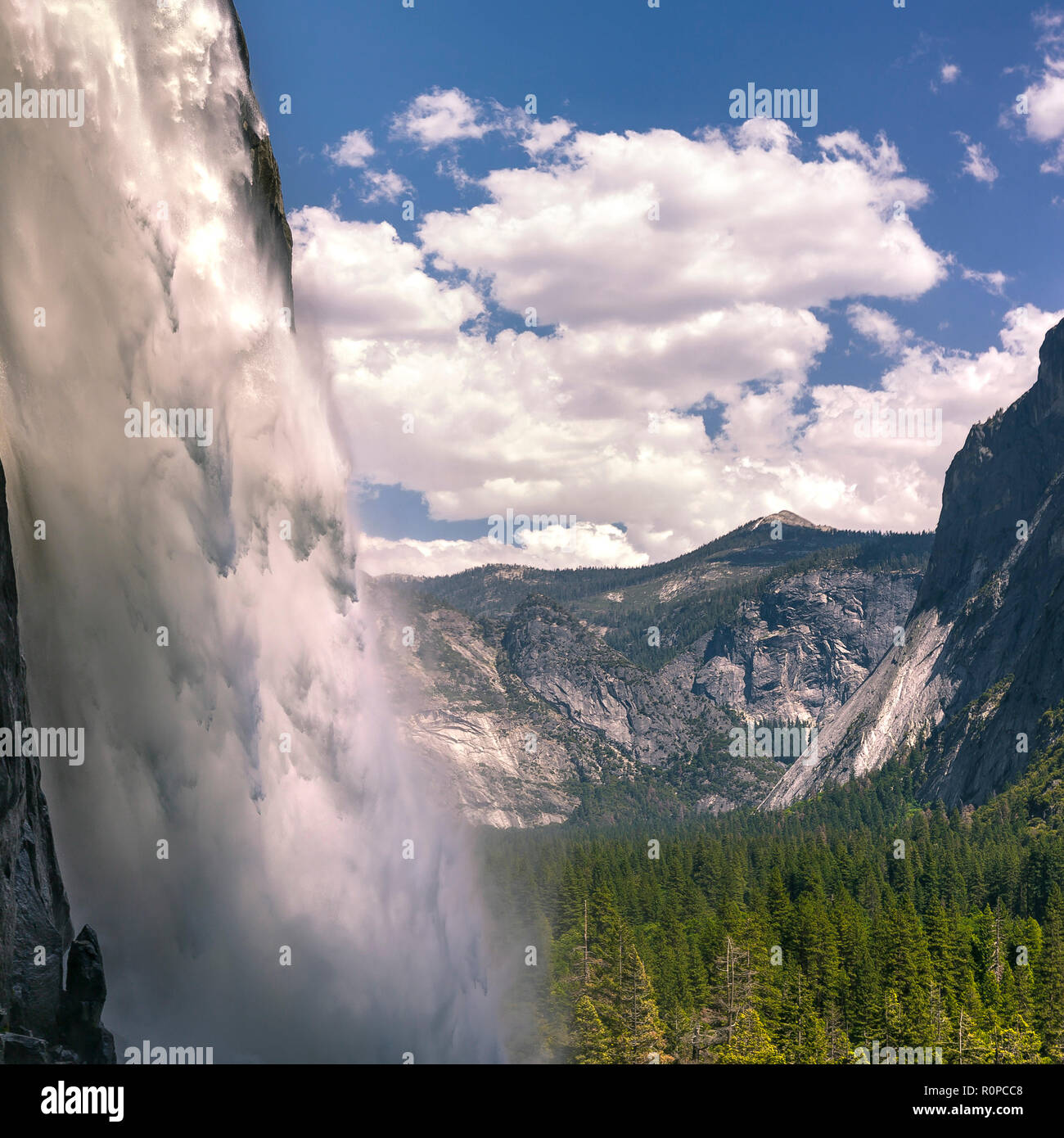 Yosemite Falls and valley against cloudy blue sky Stock Photo - Alamy