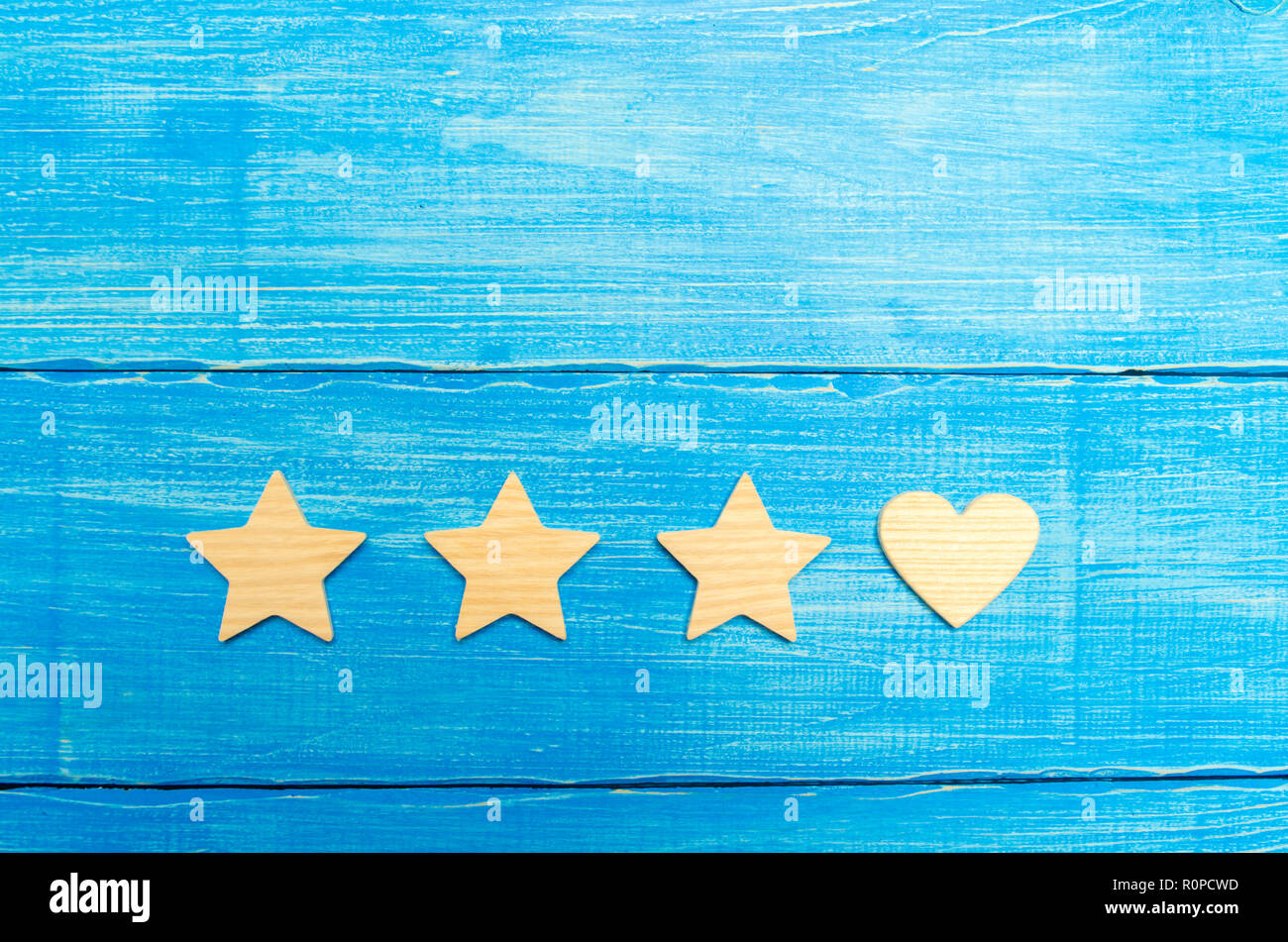 Three stars and a heart on a blue background. Selection of the user and ...