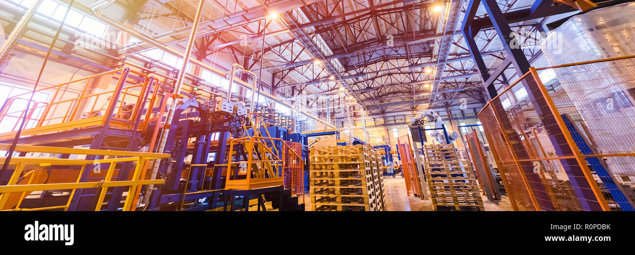 Fiberglass production industry equipment at manufacture background ...