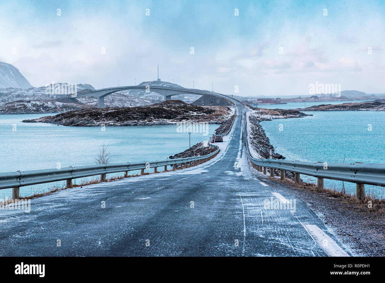 Winter road over the sea with snowy peak on Lofoten Islands, Norway ...