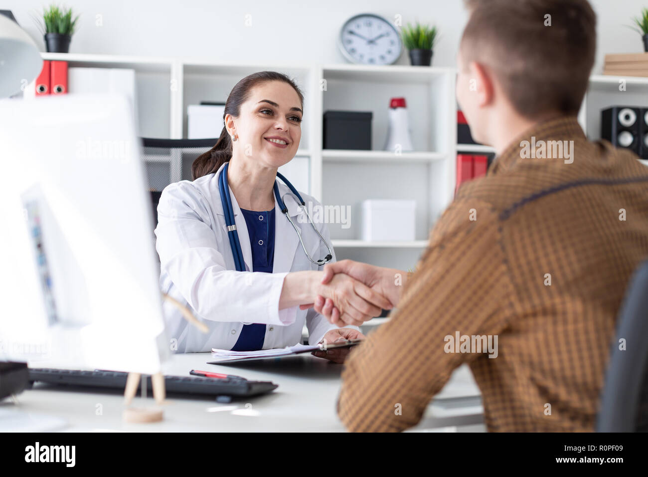 The doctor and the patient shake hands Stock Photo - Alamy