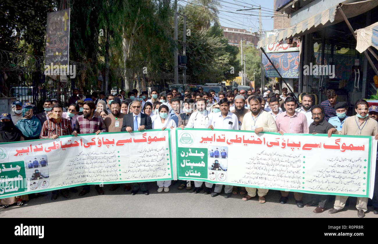 Participants pass through a road during awareness walk on anti-smog ...