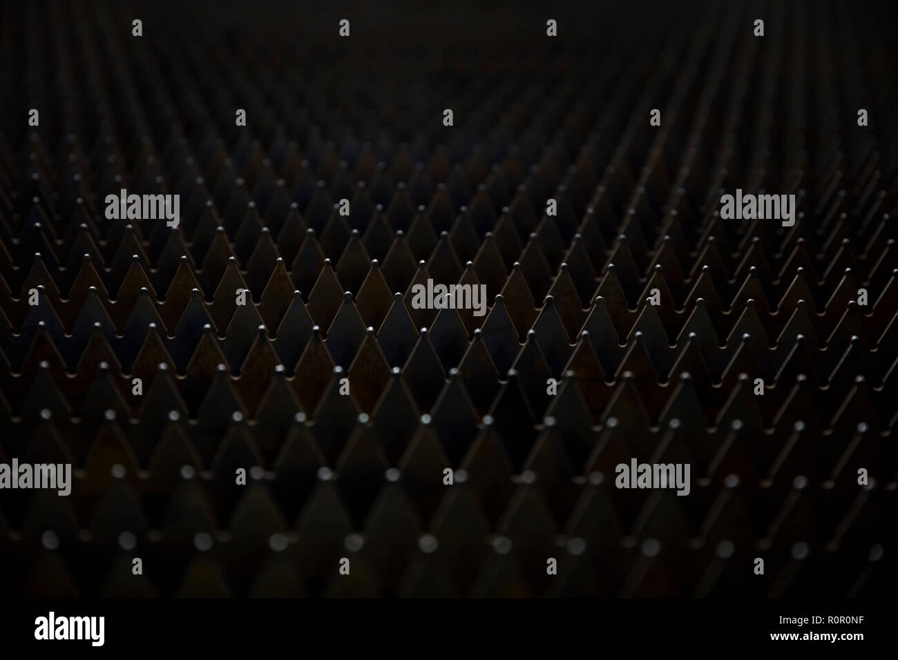 Detail of the sheet metal spikes backdrop Stock Photo - Alamy