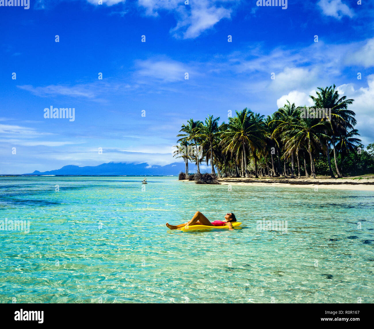 Woman sunbathing on lilo in hi-res stock photography and images - Alamy