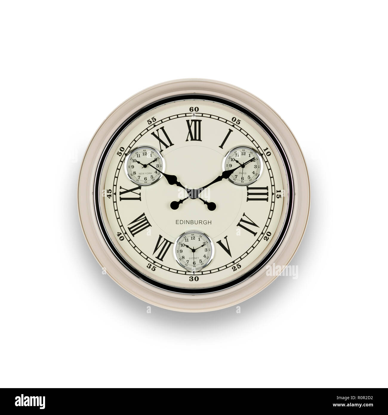 Cream clock on a white wall or isolated on a white background with a ...