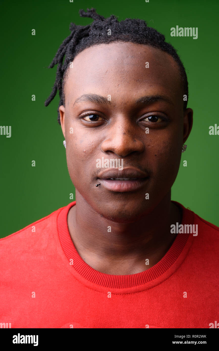 Young handsome African man from Kenya against green background Stock ...