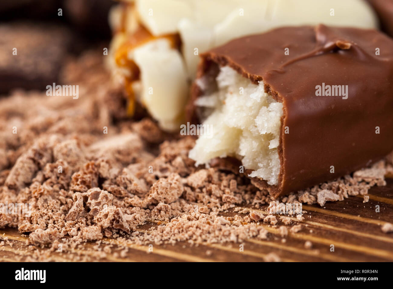 Various yummy chocolate candies on wooden table, sweets Stock Photo - Alamy