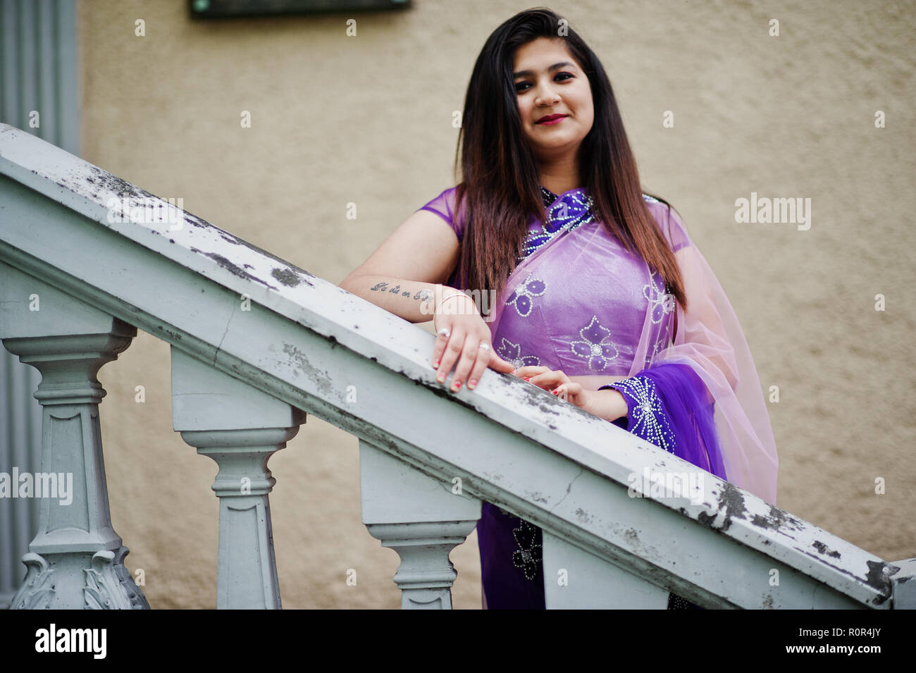 Indian hindu girl at traditional violet saree posed at street Stock ...