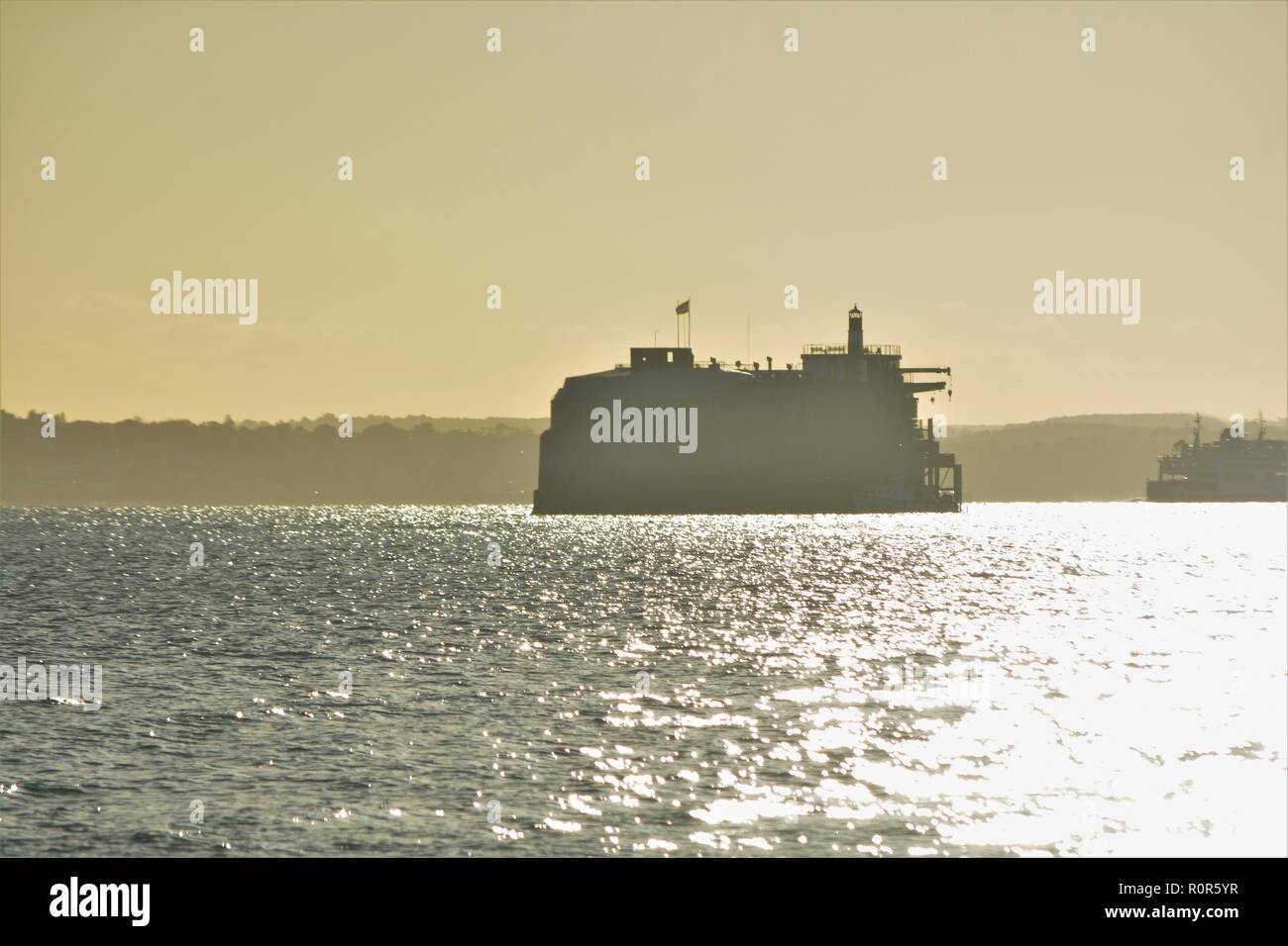 Solent sea fort with sunlight from behind Stock Photo - Alamy