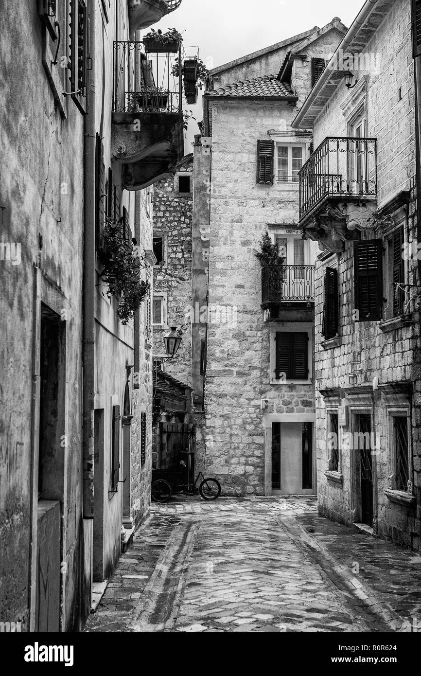 An empty back street in the old town, Kotor, Montenegro. Black and ...