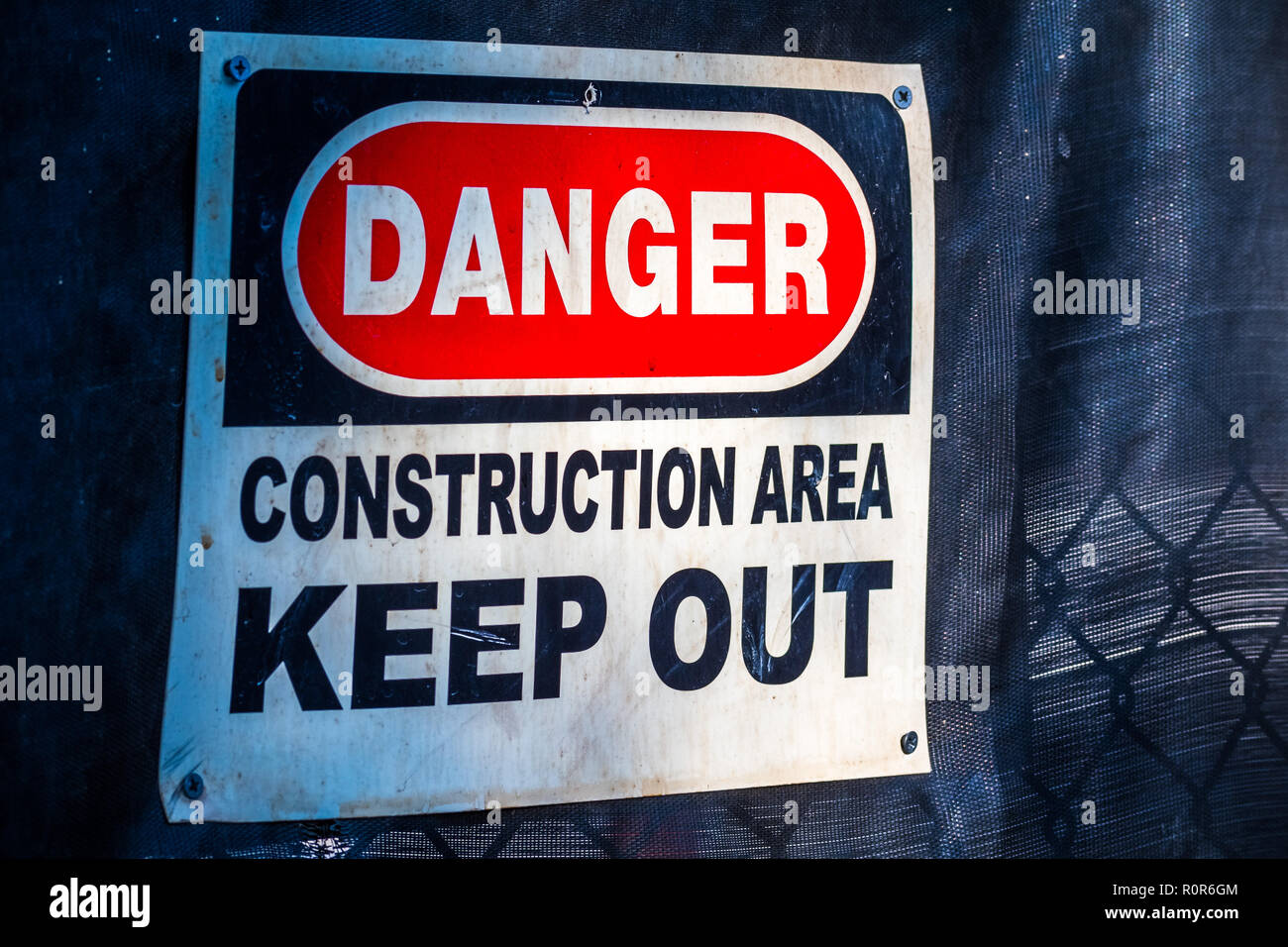 "Danger Construction Area Keep Out" sign posted on a fence at a ...