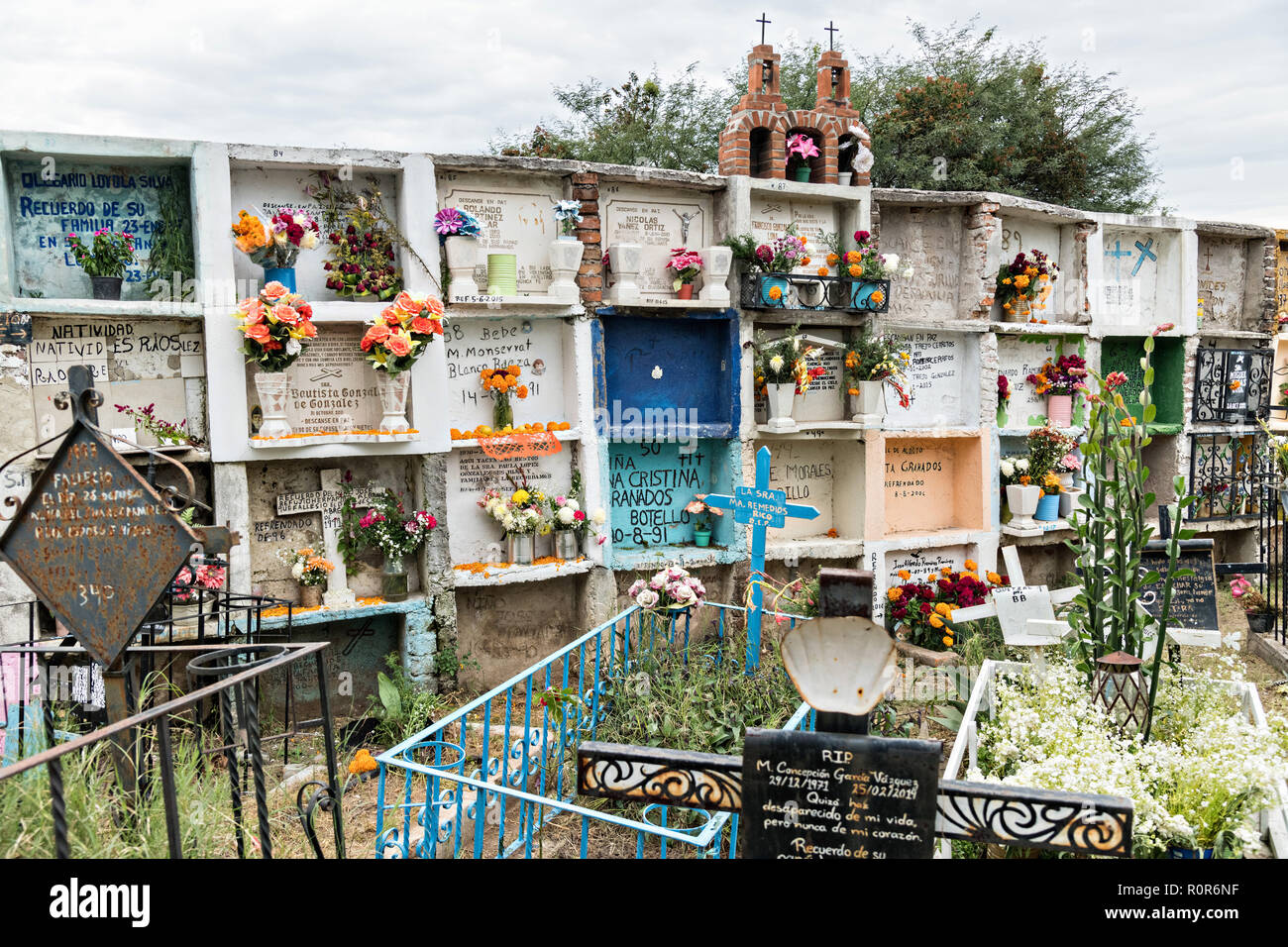 Decorated cremation niches at the Our Lady of Guadalupe cemetery during ...