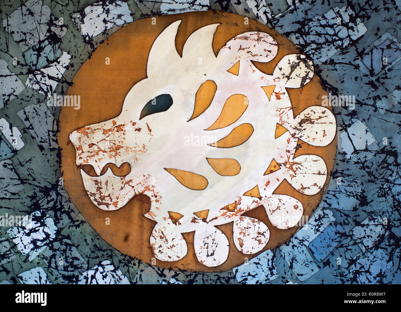 Lion head in circle, fragment, hot batik, background texture, handmade ...