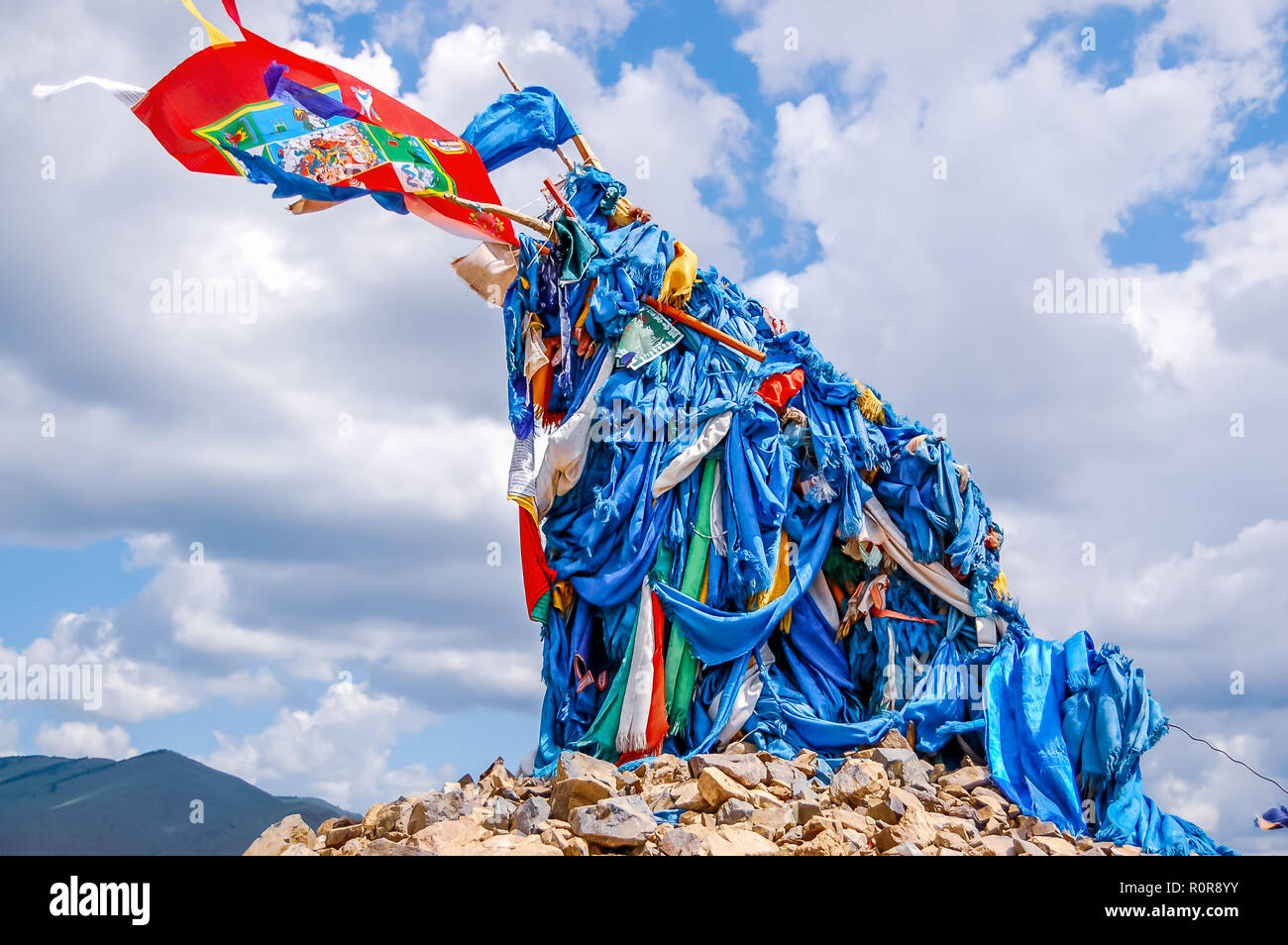 Mongolian sacred cairn or ovoo & prayer flags to worship mountains, sky ...