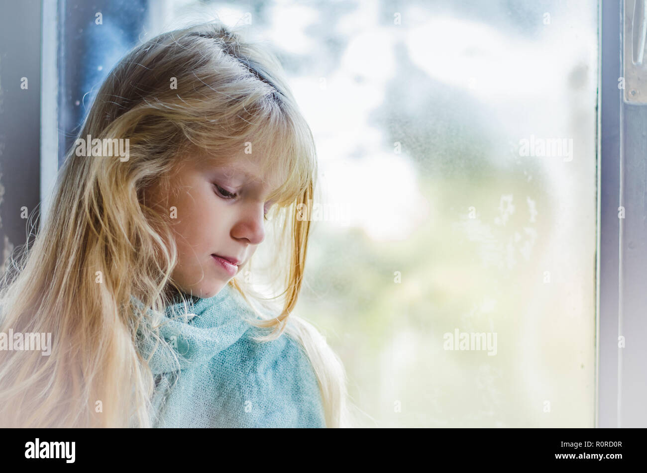 Baby sitting window looking outside hi-res stock photography and images ...