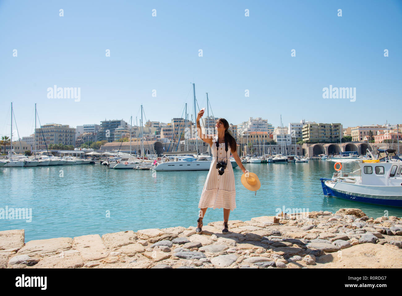 Traveling tourist woman on vacation in Heraklion Crete walking at the ...