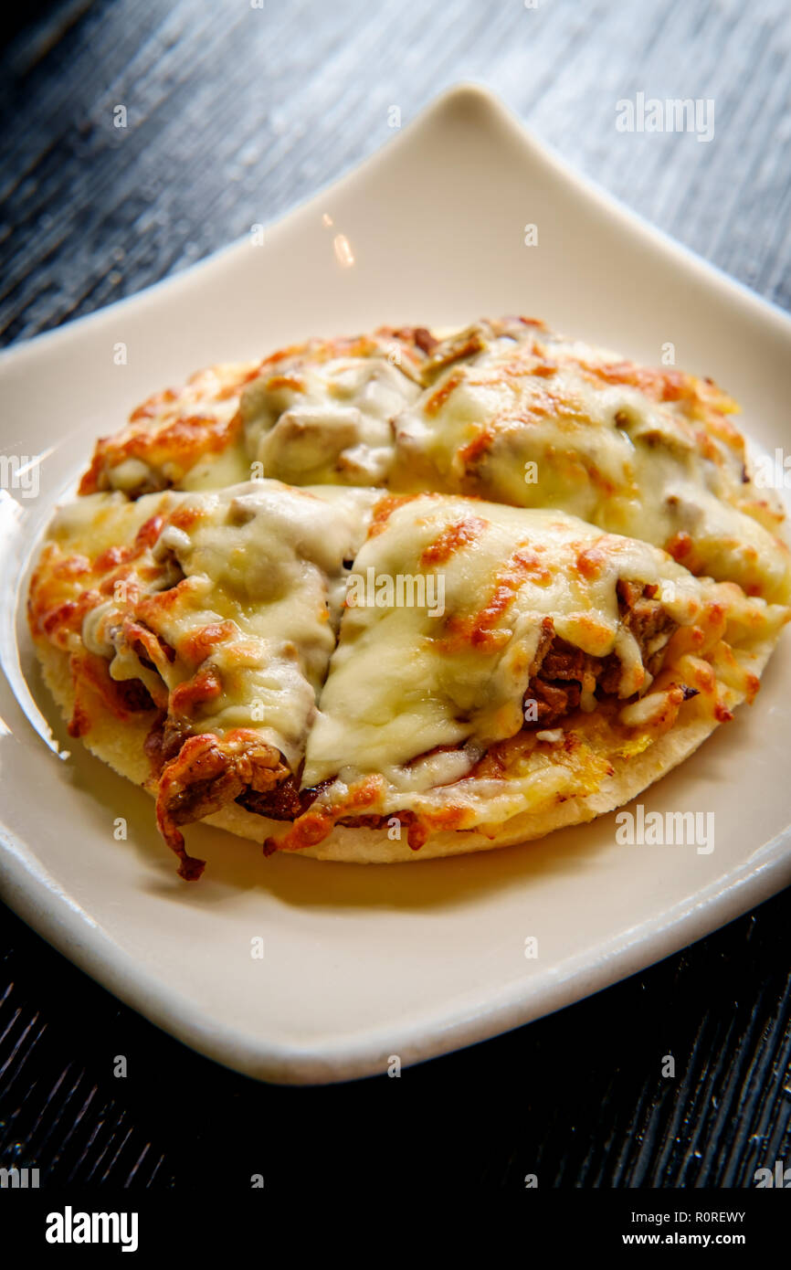 Colombian cuisine loaded grilled cheese arepas with bacon Stock Photo ...