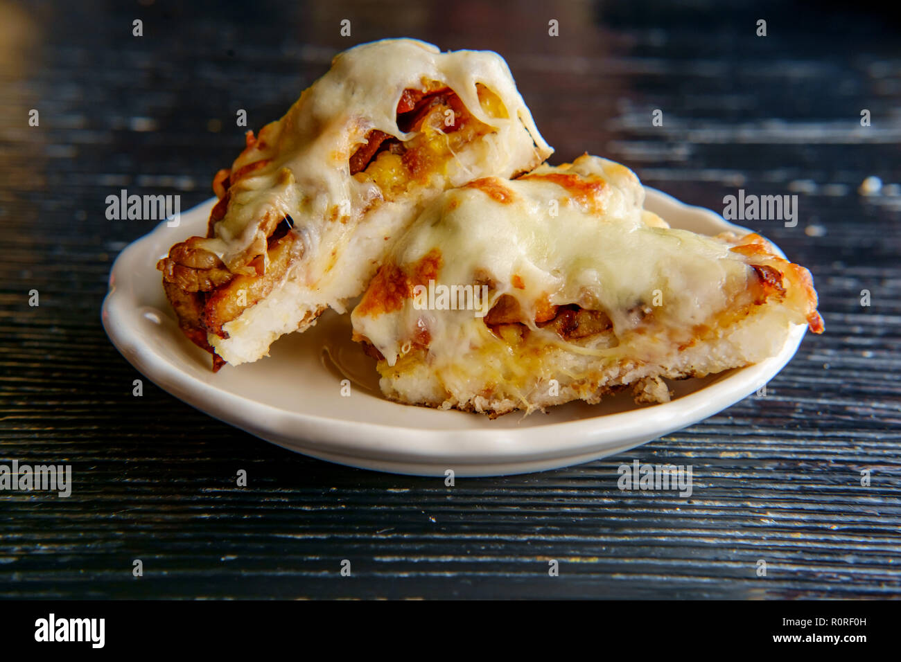 Colombian cuisine loaded grilled cheese arepas with bacon Stock Photo ...