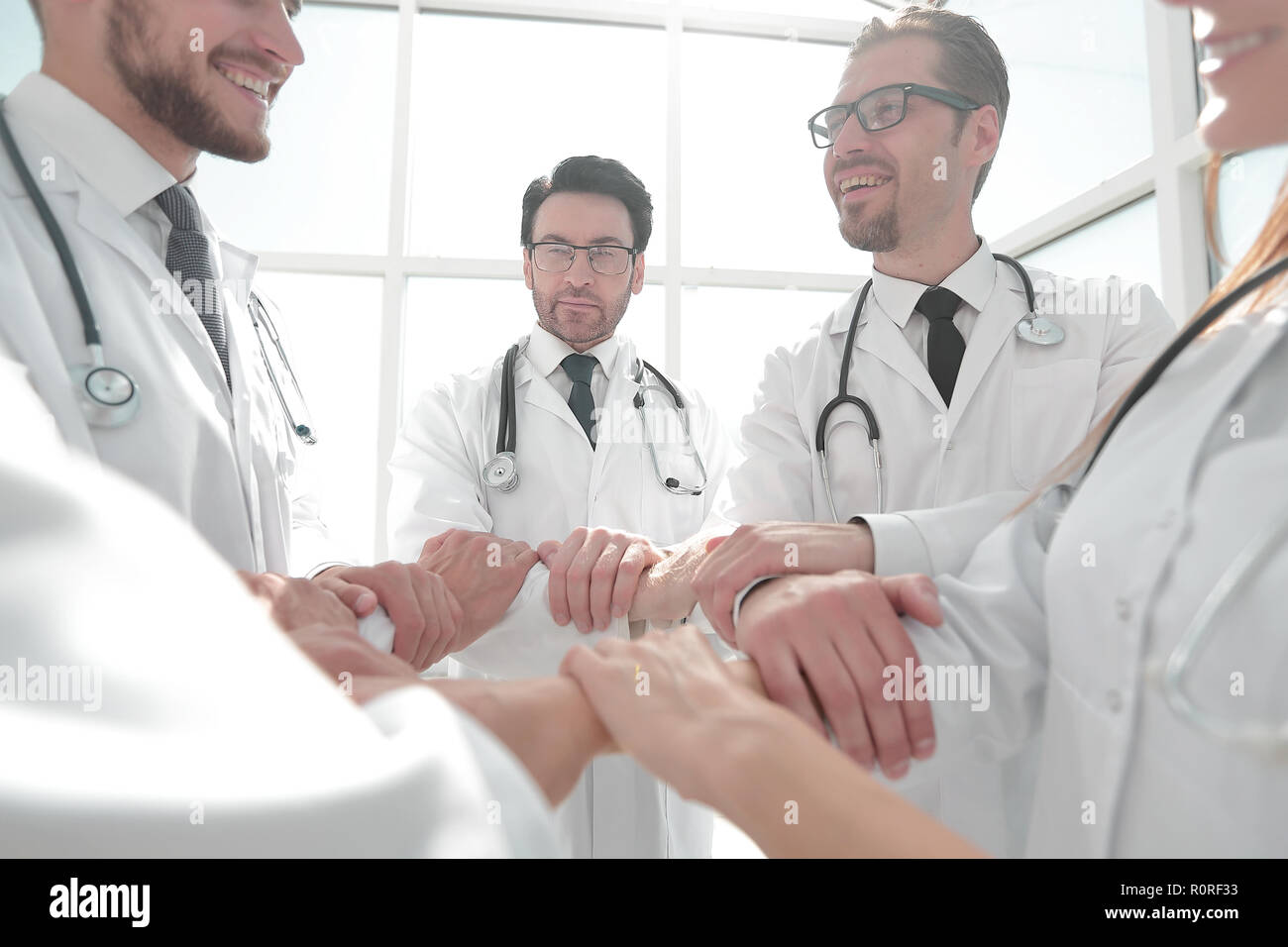 close up.a group of doctors standing in a circle Stock Photo - Alamy