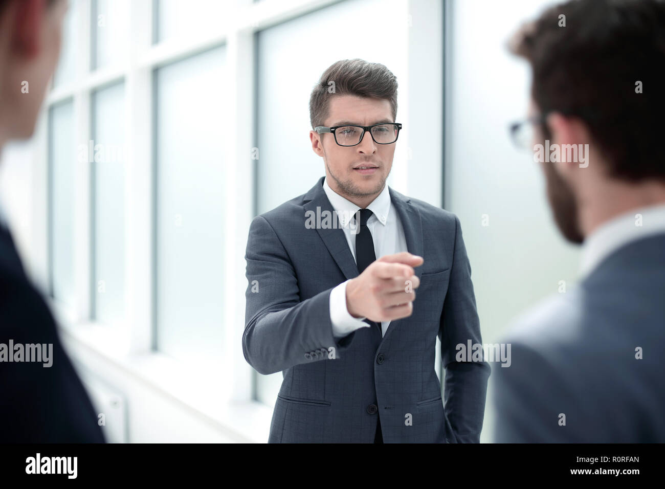 boss and staff standing in the office Stock Photo - Alamy