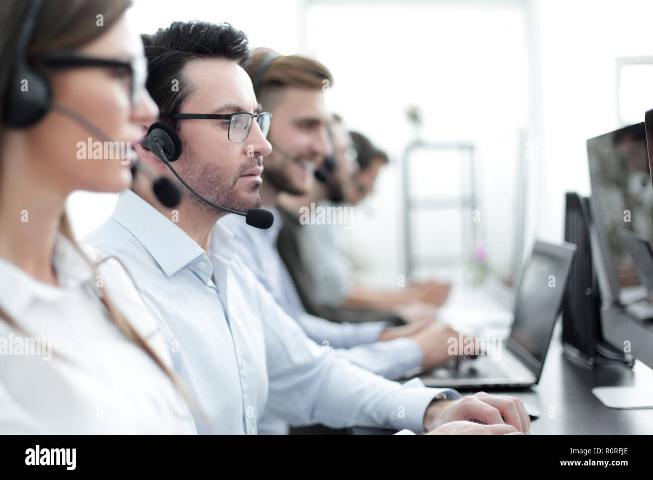 close up.background image of call center employees in the workplace ...