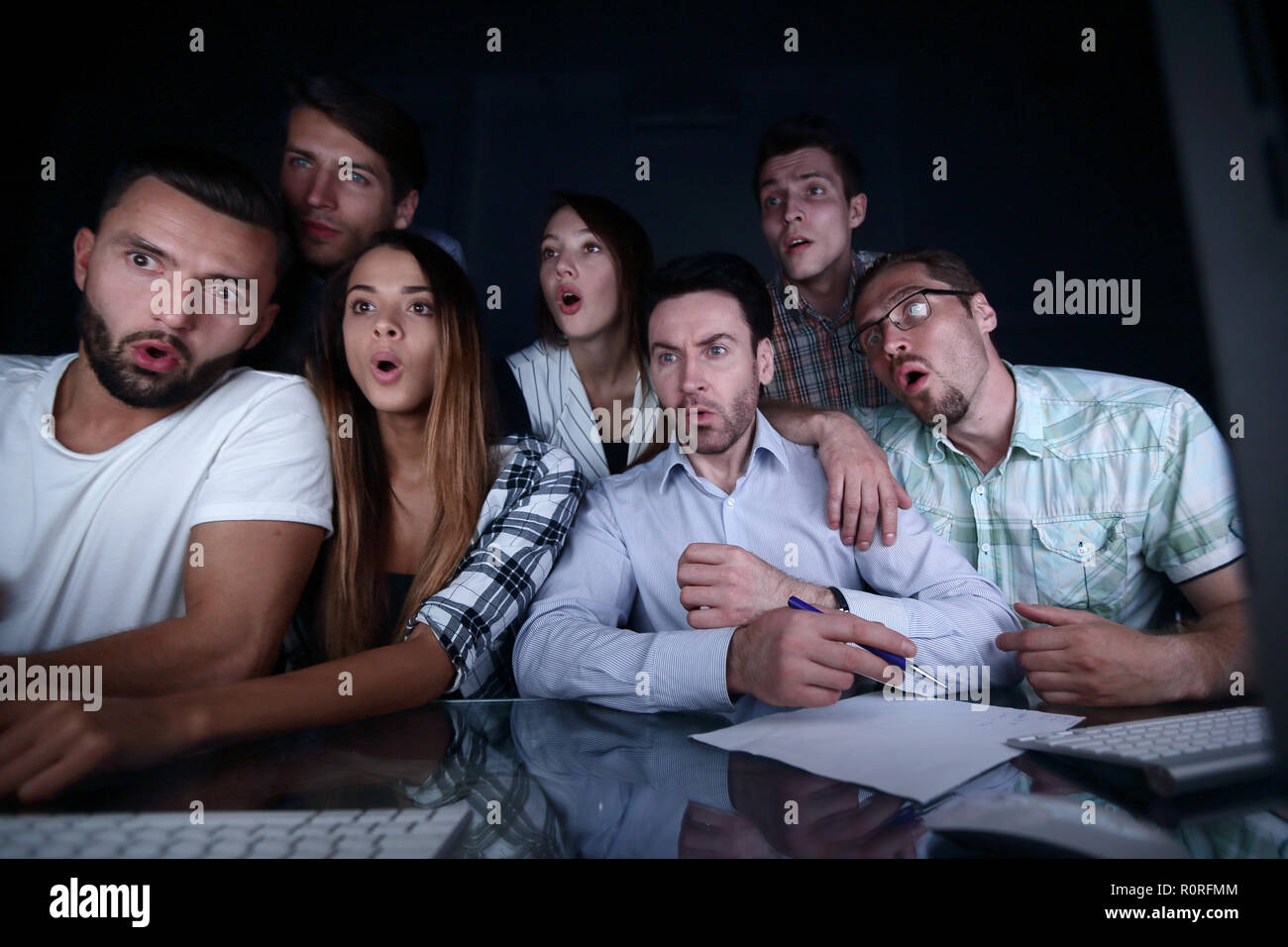 surprised business team looking at the computer monitor Stock Photo - Alamy
