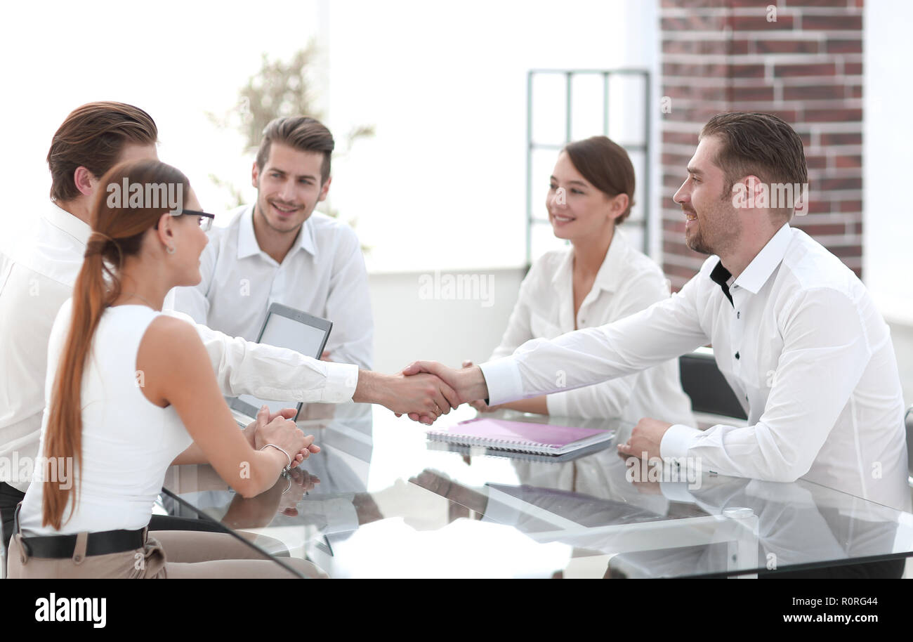 business partners, confirming the transaction by handshake Stock Photo ...