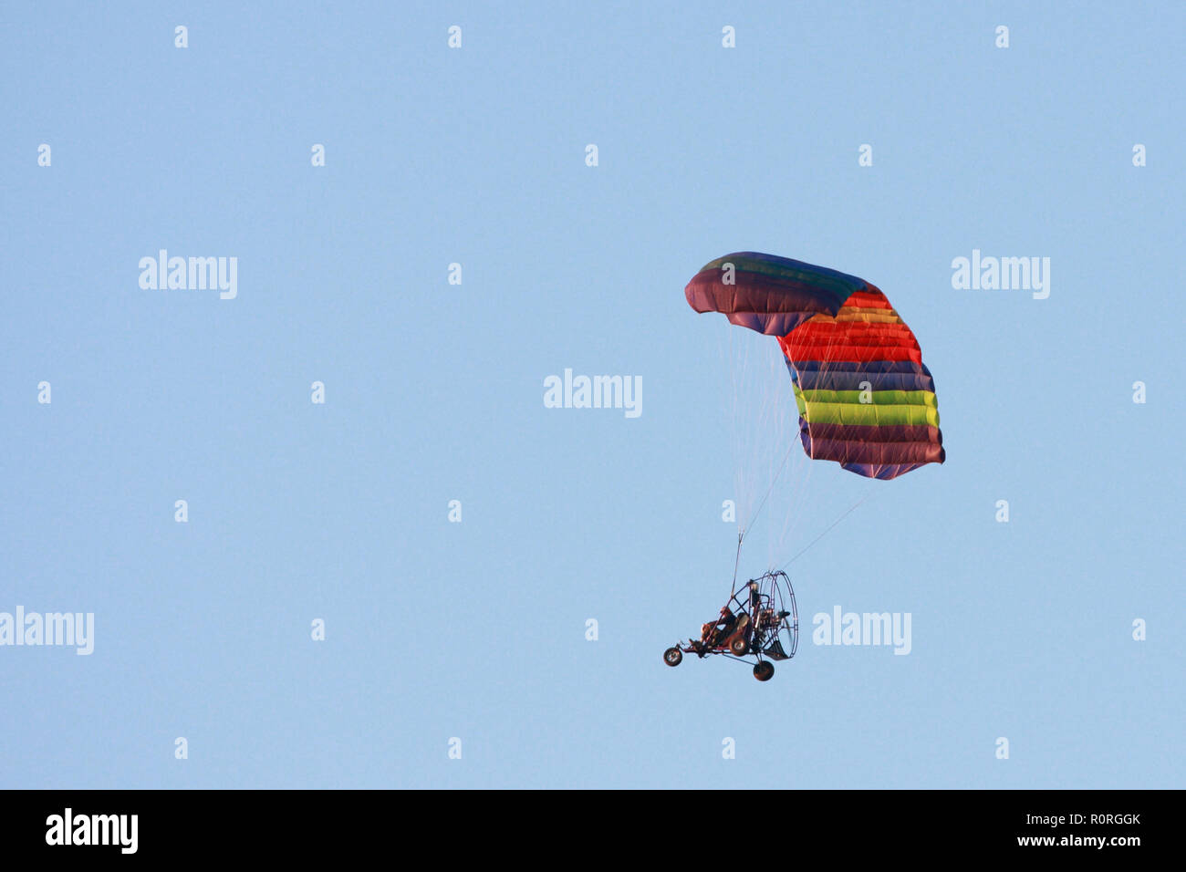 Colorful Paraplane in flight Stock Photo - Alamy