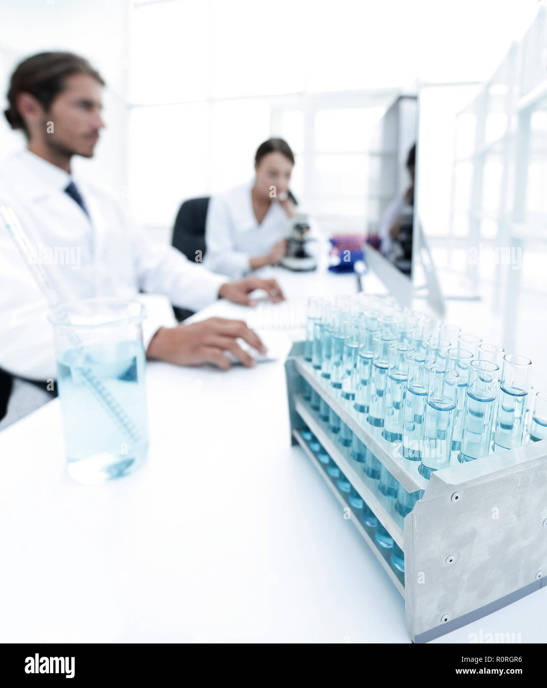 side view of scientists working in laboratory Stock Photo - Alamy