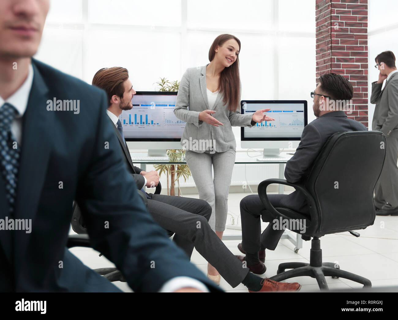 A male office worker browsing the computer for information Stock Photo ...