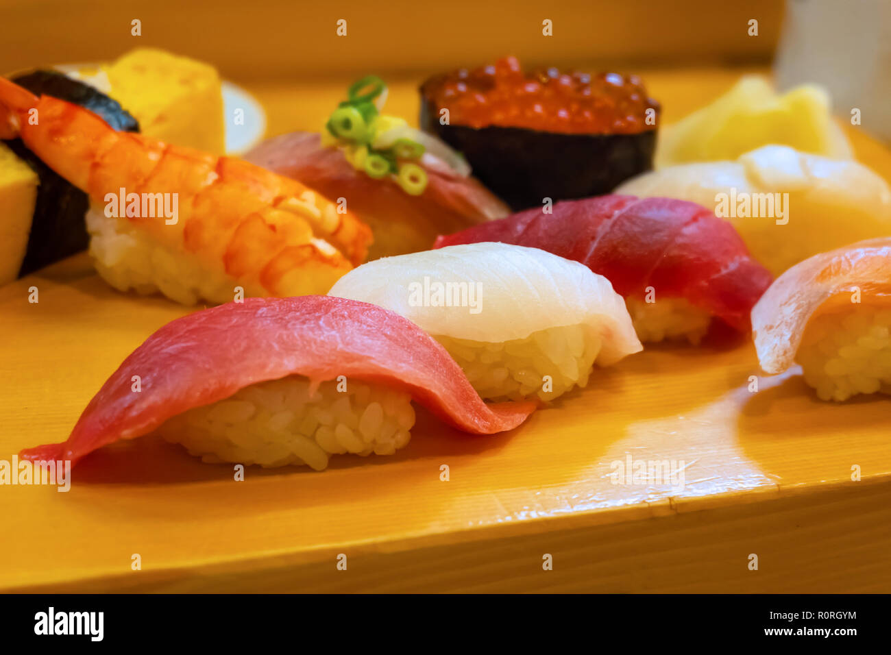 A set of japanese traditional sushi set beautifully decorated on a wood ...