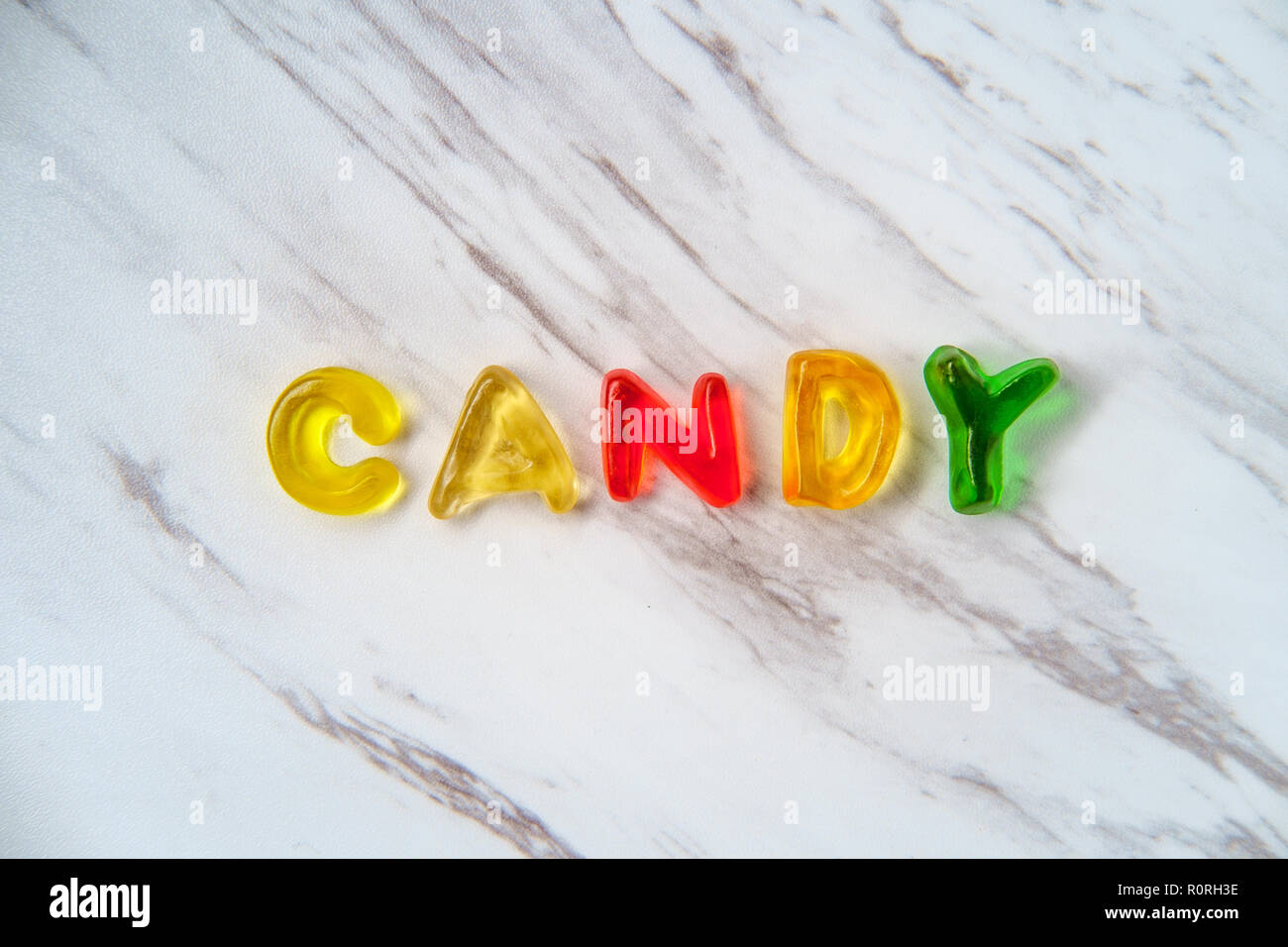 Assorted colorful gummy candy letters spell the word Candy Stock Photo ...
