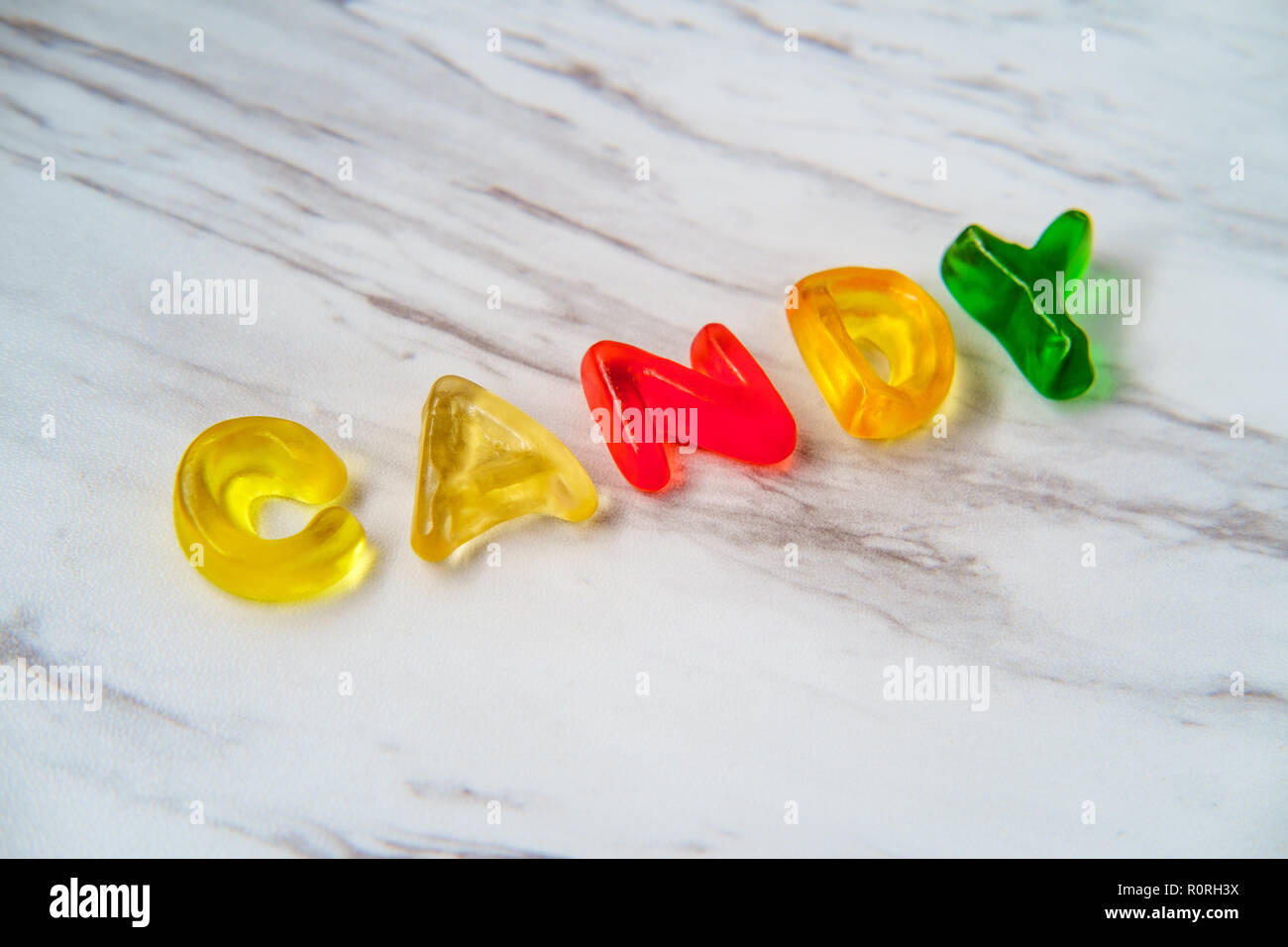 Assorted colorful gummy candy letters spell the word Candy Stock Photo ...