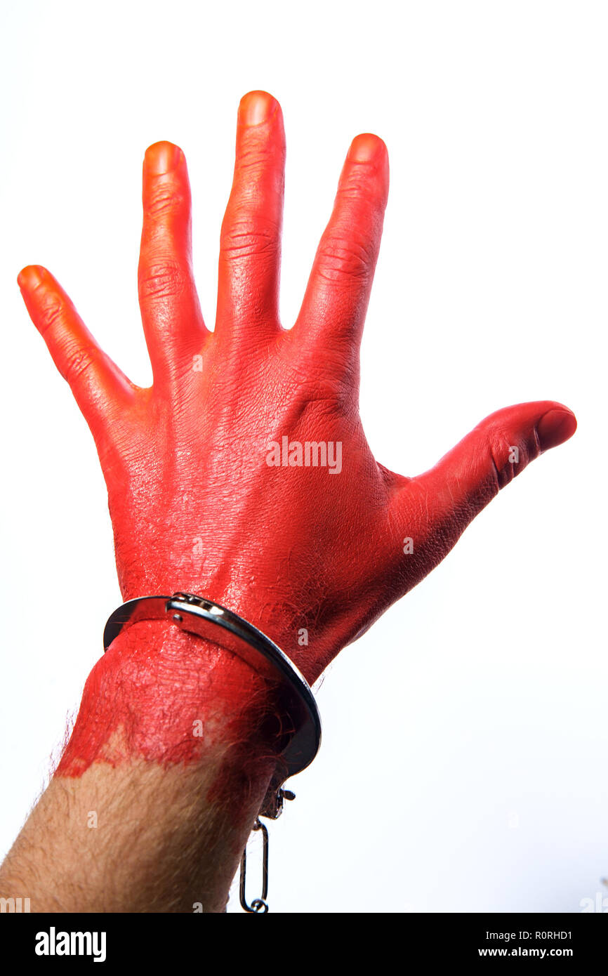 Caught red handed - hand painted red wearing handcuffs concept Stock ...