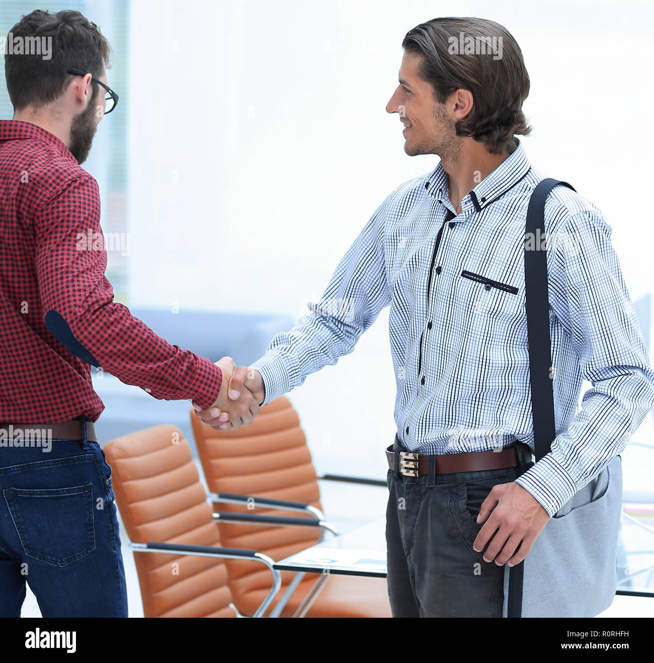 handshake Manager and the client in the office Stock Photo - Alamy