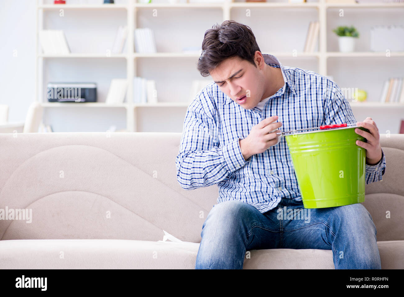 Sick man suffering at home from infection and bad stomach Stock Photo ...