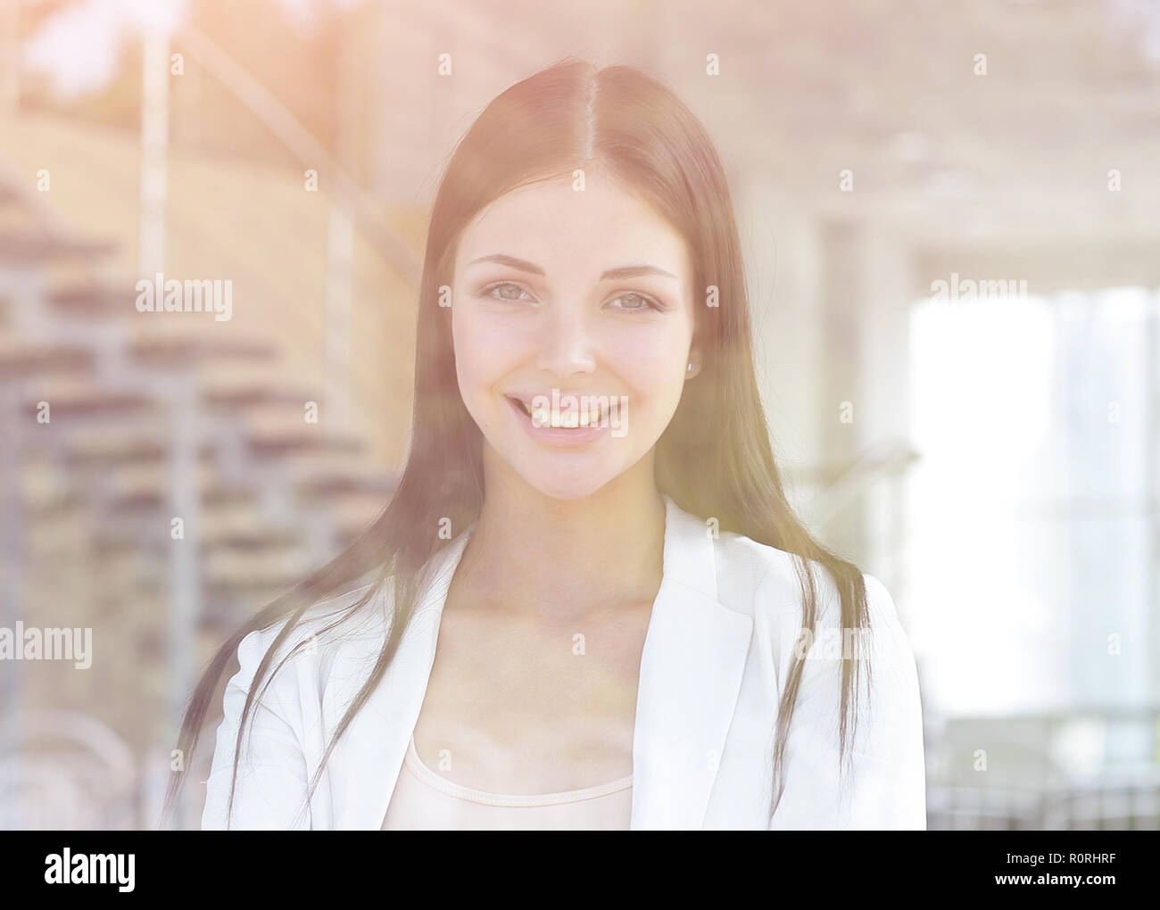 smiling business woman looking out the window Stock Photo - Alamy