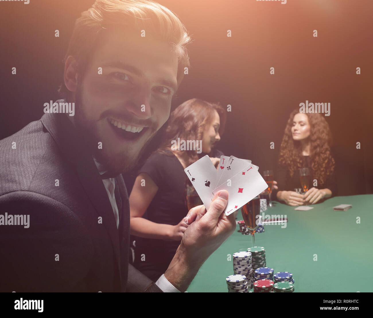 Lucky man with the winning combination of cards Stock Photo - Alamy