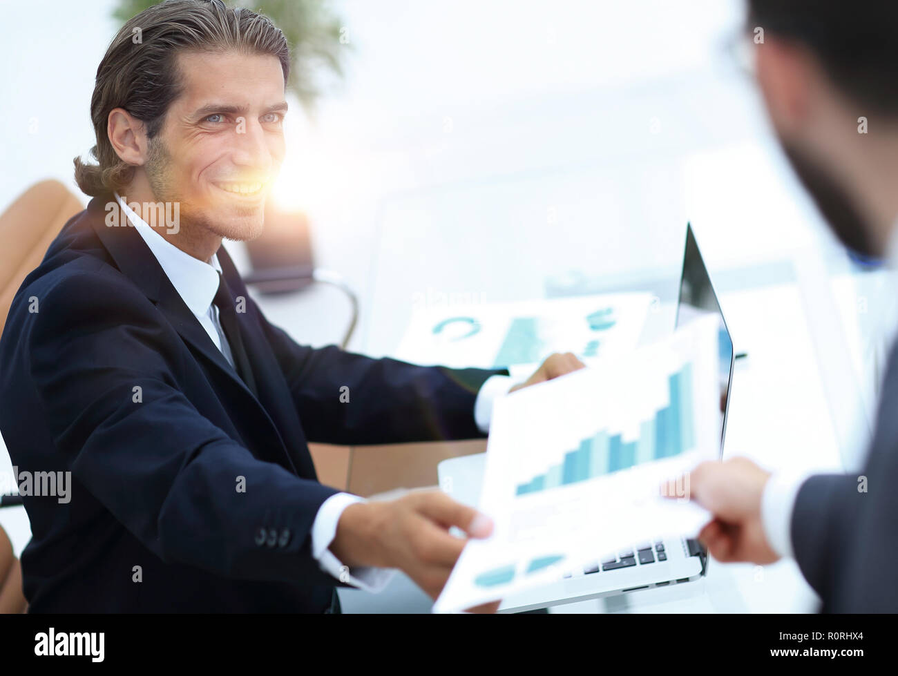 employee gives the Manager the financial report Stock Photo - Alamy