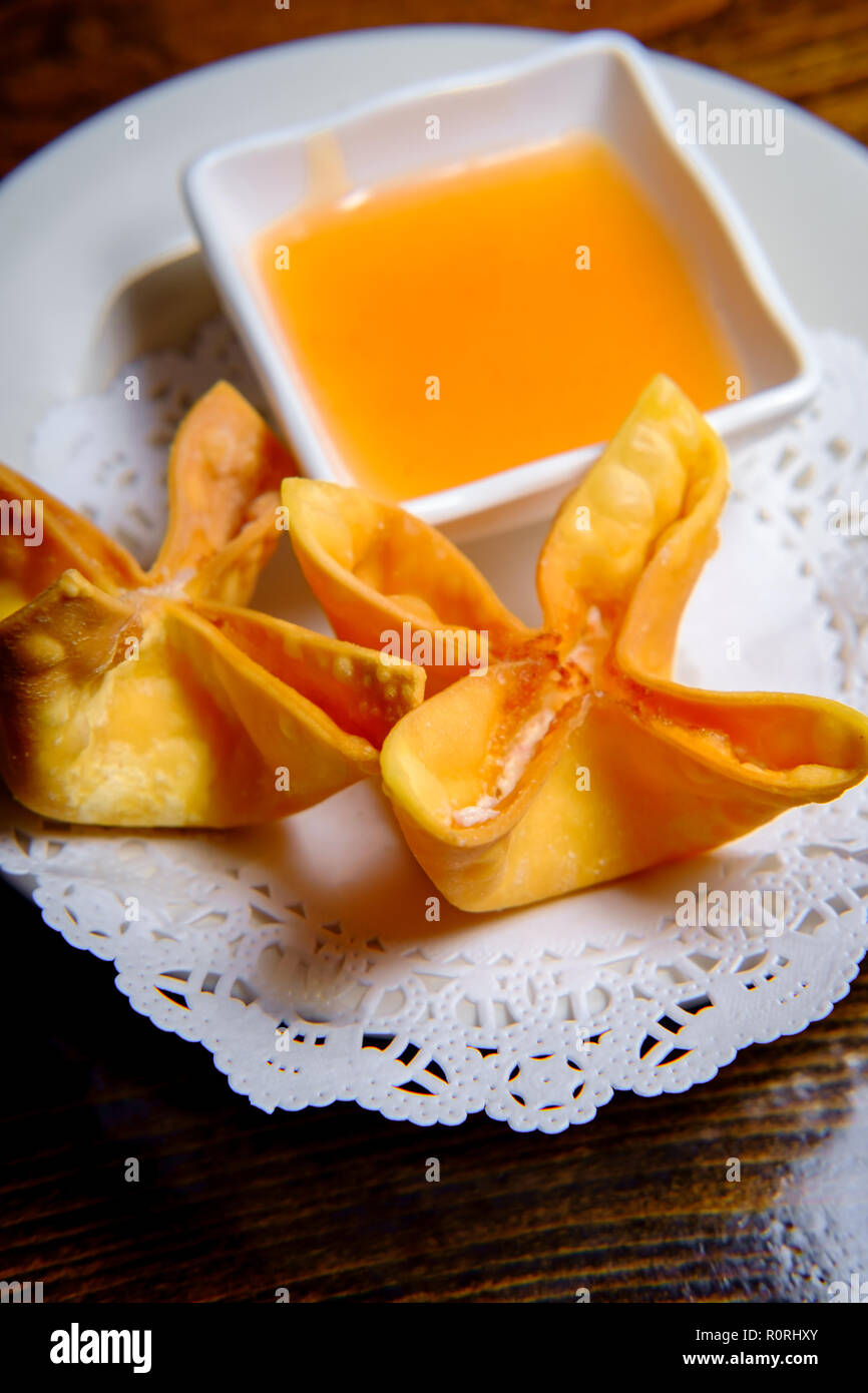 Chinese cheese wontons appetizer at restaurant served on fancy plate ...