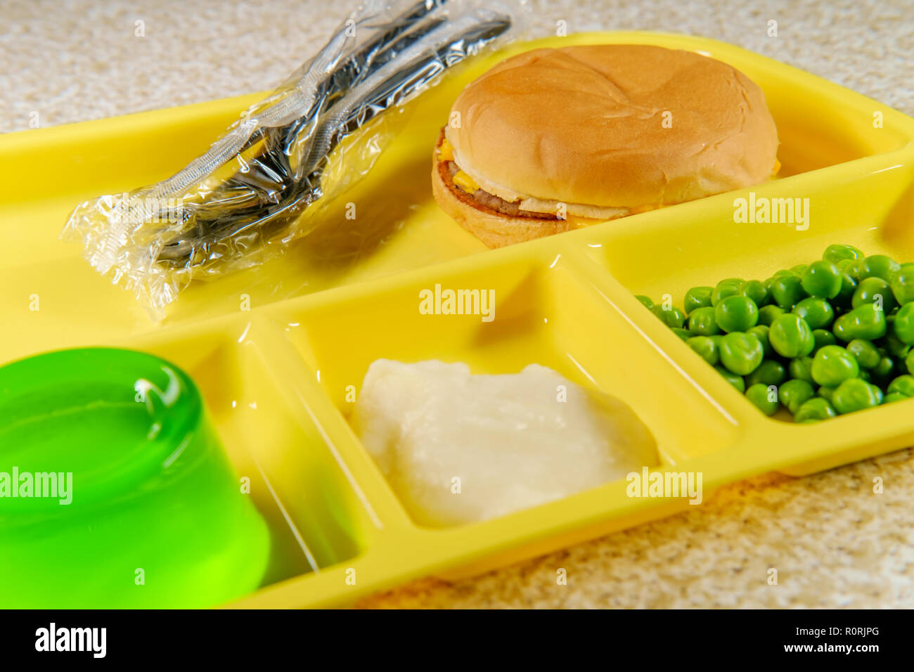Elementary school lunch cheeseburger with mashed potatoes gelatin and ...