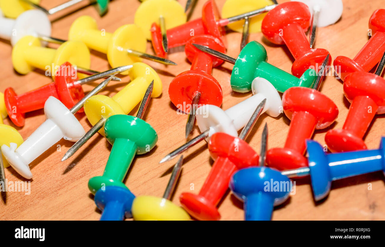 colorful push pins. office and school supply background Stock Photo - Alamy