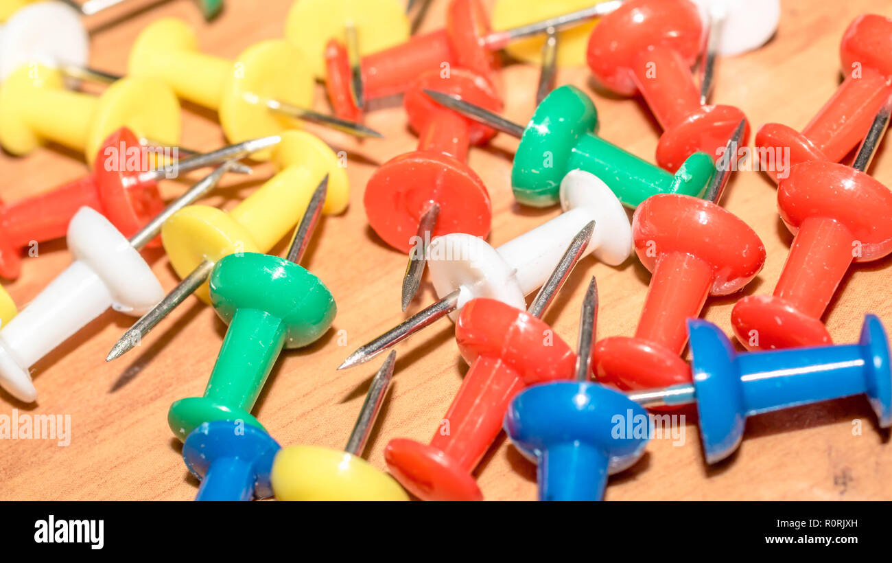 colorful push pins. office and school supply background Stock Photo - Alamy